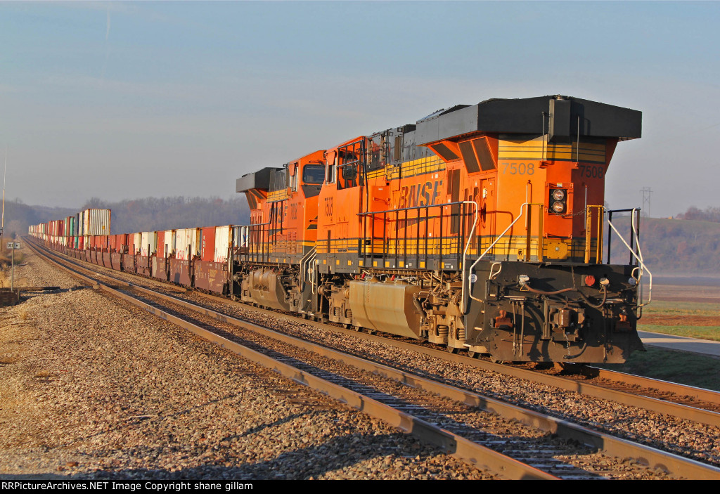BNSF 7508 shoves Wb on a stack train.